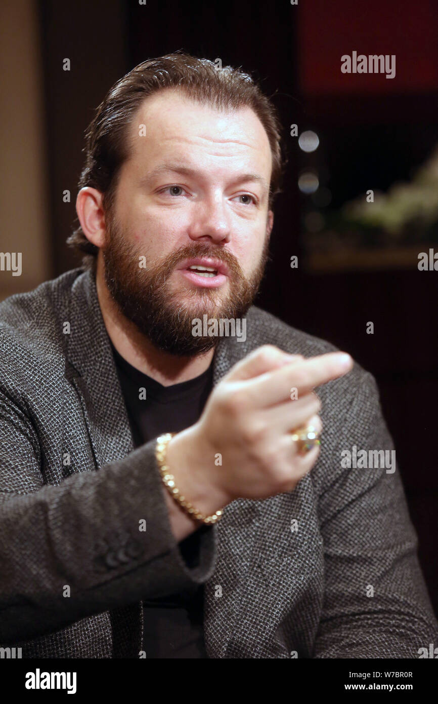Latvian conductor Andris Nelsons, right, talks with Chinese TV host Cao ...