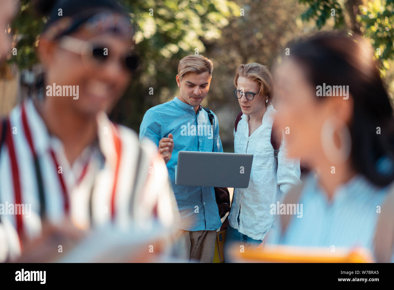 Two students working on their project on laptop Stock Photo - Alamy