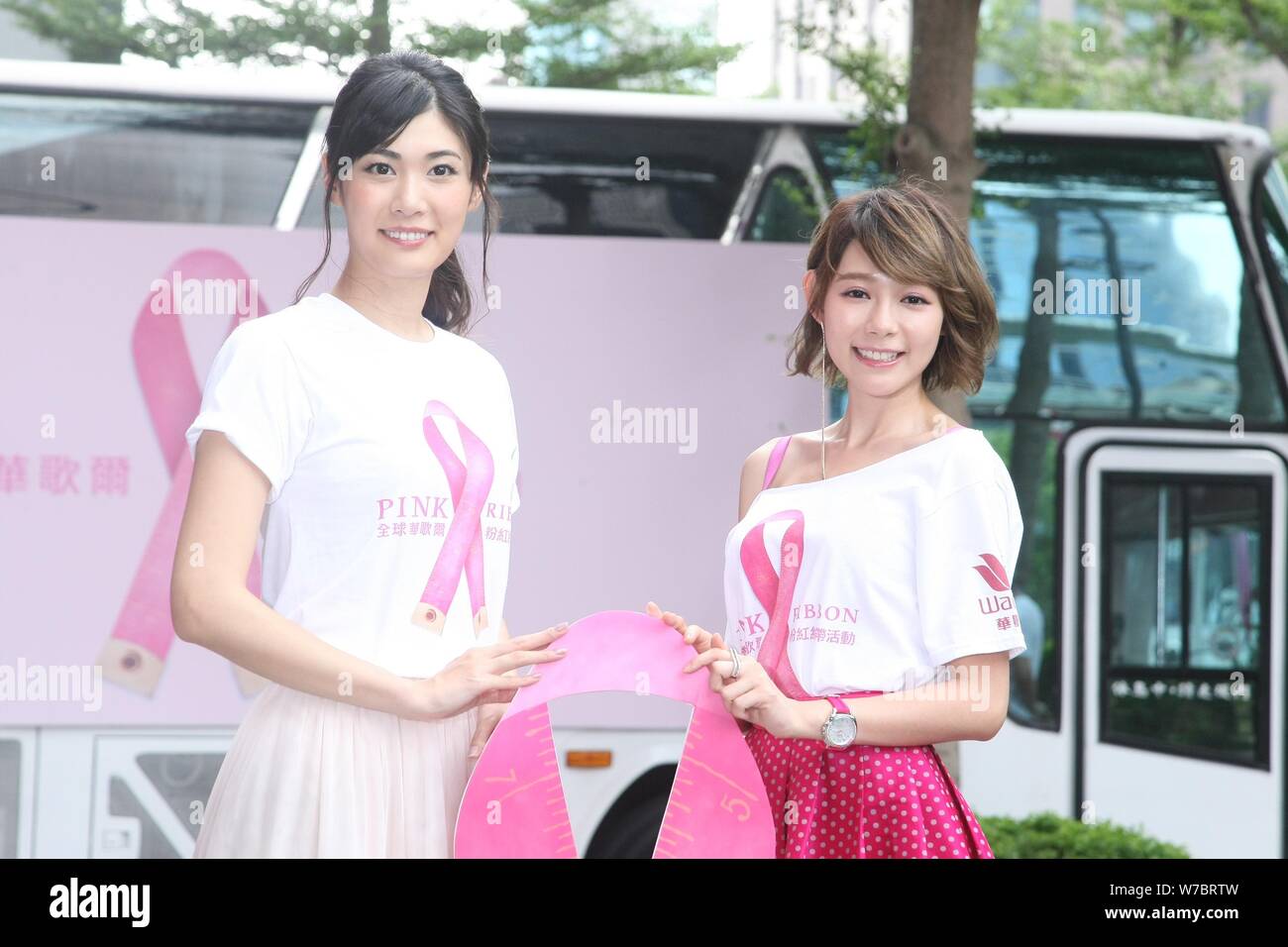 Japanese actress Youki Kato, left, and Malaysian singer and model Lin Min-Chen attend a pink ...