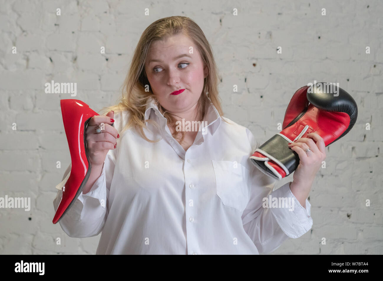 Portrait of attractive plus size woman having emotions of choice ...