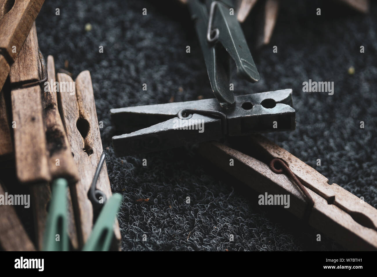 Details with a stack of plastic and wooden clothes pegs Stock Photo - Alamy