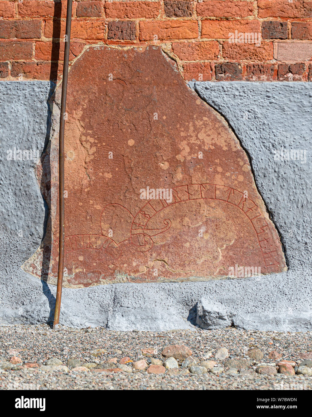 An old rune stone has been used in the construction hi-res stock ...