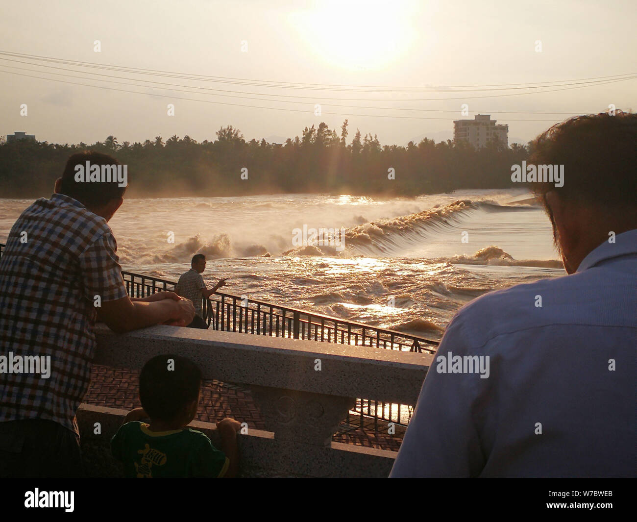 Local residents watch the cattle ridge road of hydropower station ...