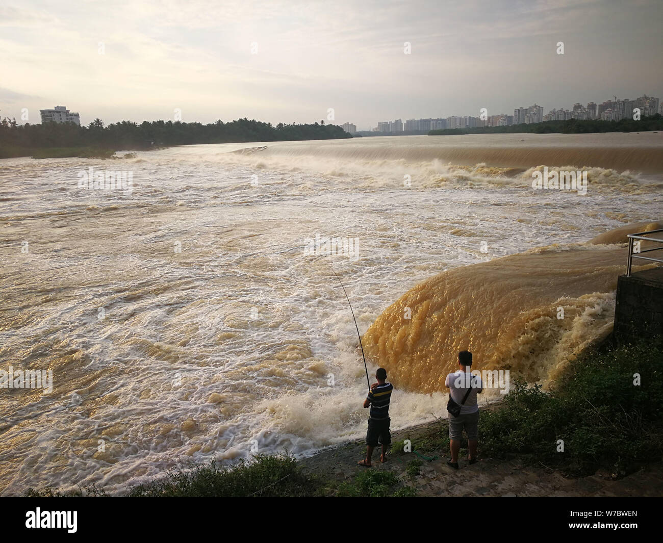 Local residents watch the cattle ridge road of hydropower station ...