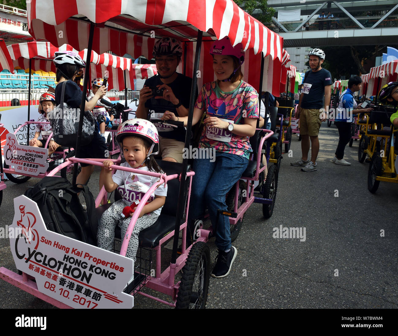 Participants pose during the third Hong Kong Cyclothon, which is hosted ...