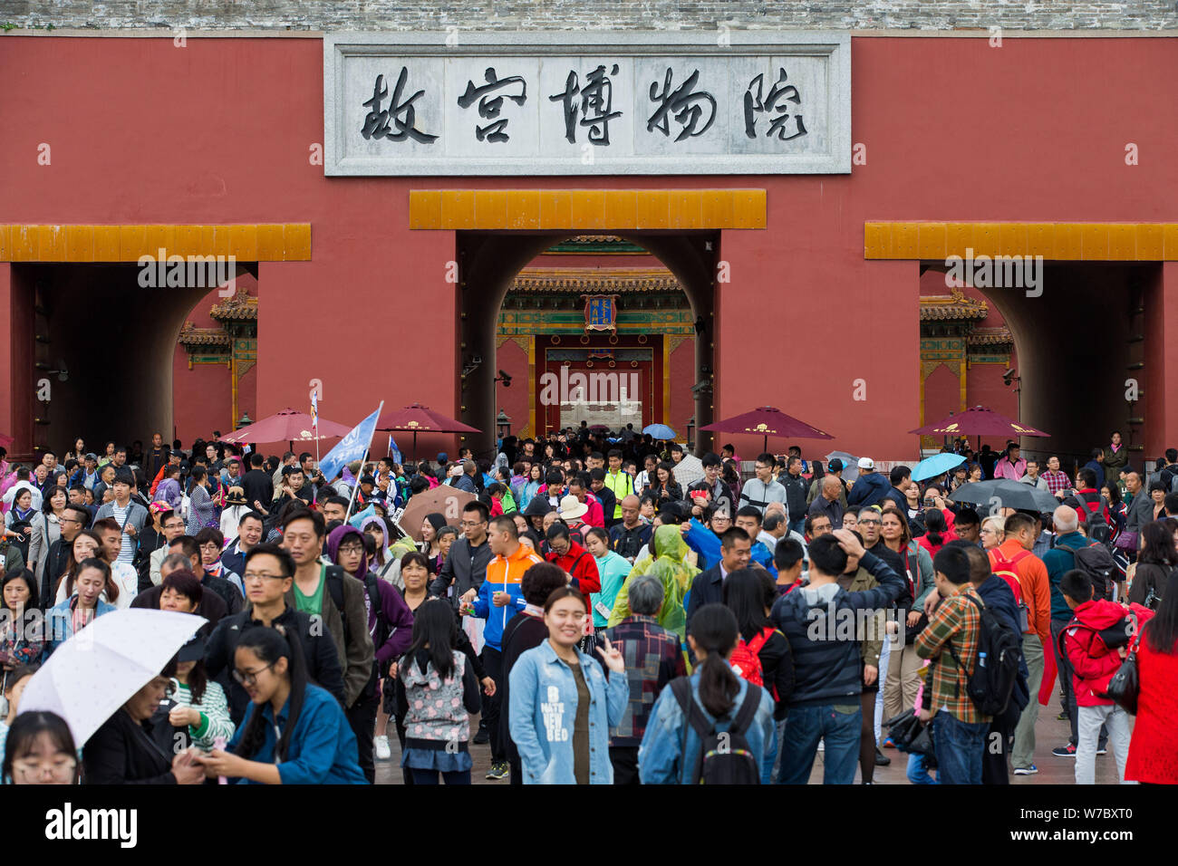 Tourists crowd the Palace Museum, also known as the Forbidden City ...