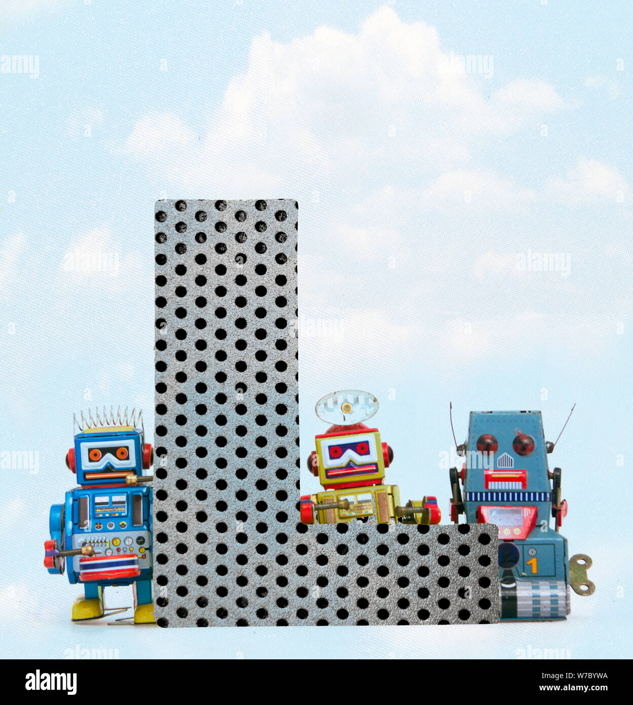 retro robots holding a big metal letter L with blue sky and clouds ...