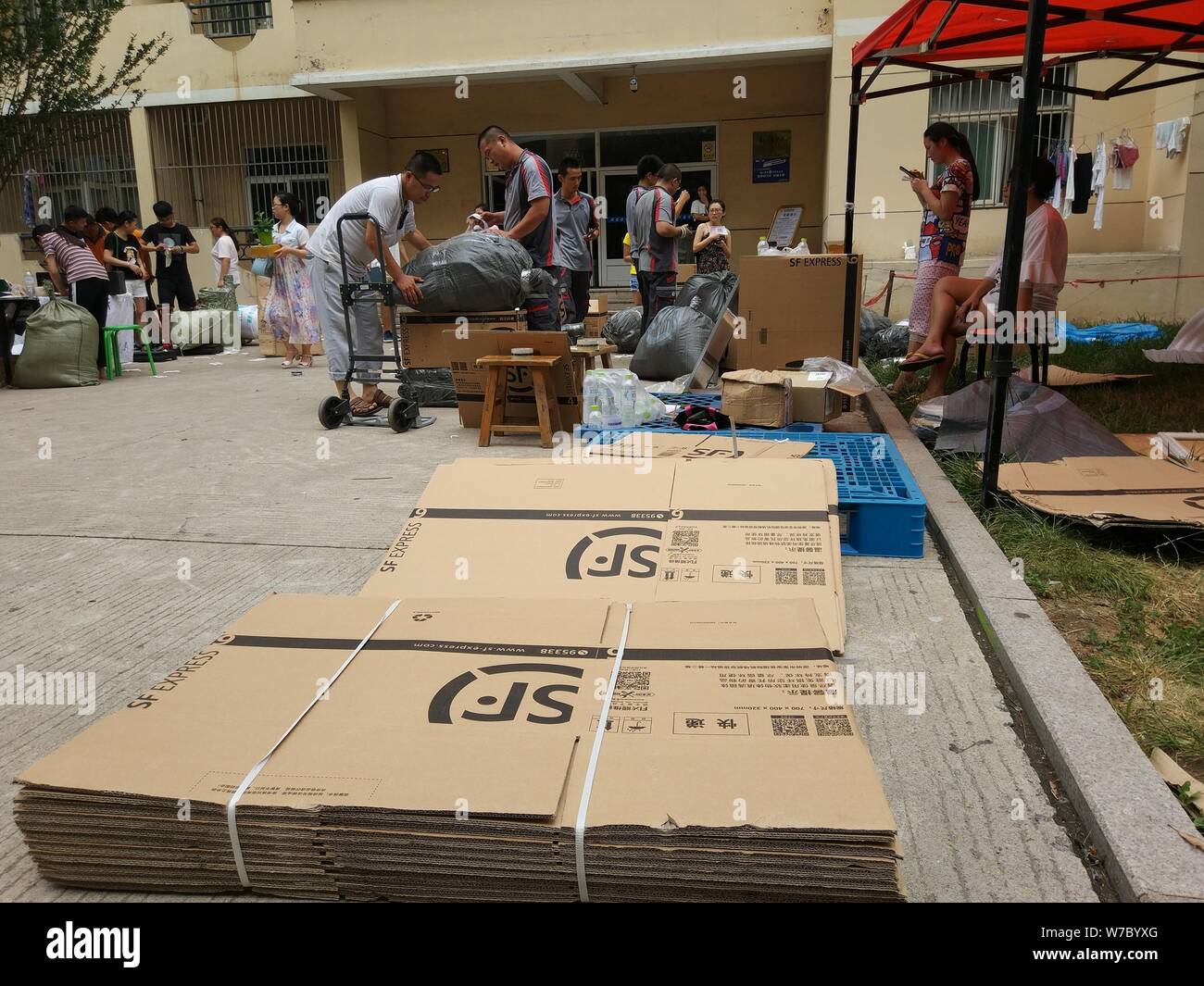 --FILE--The cartons to be delivered as parcels are seen at a university ...