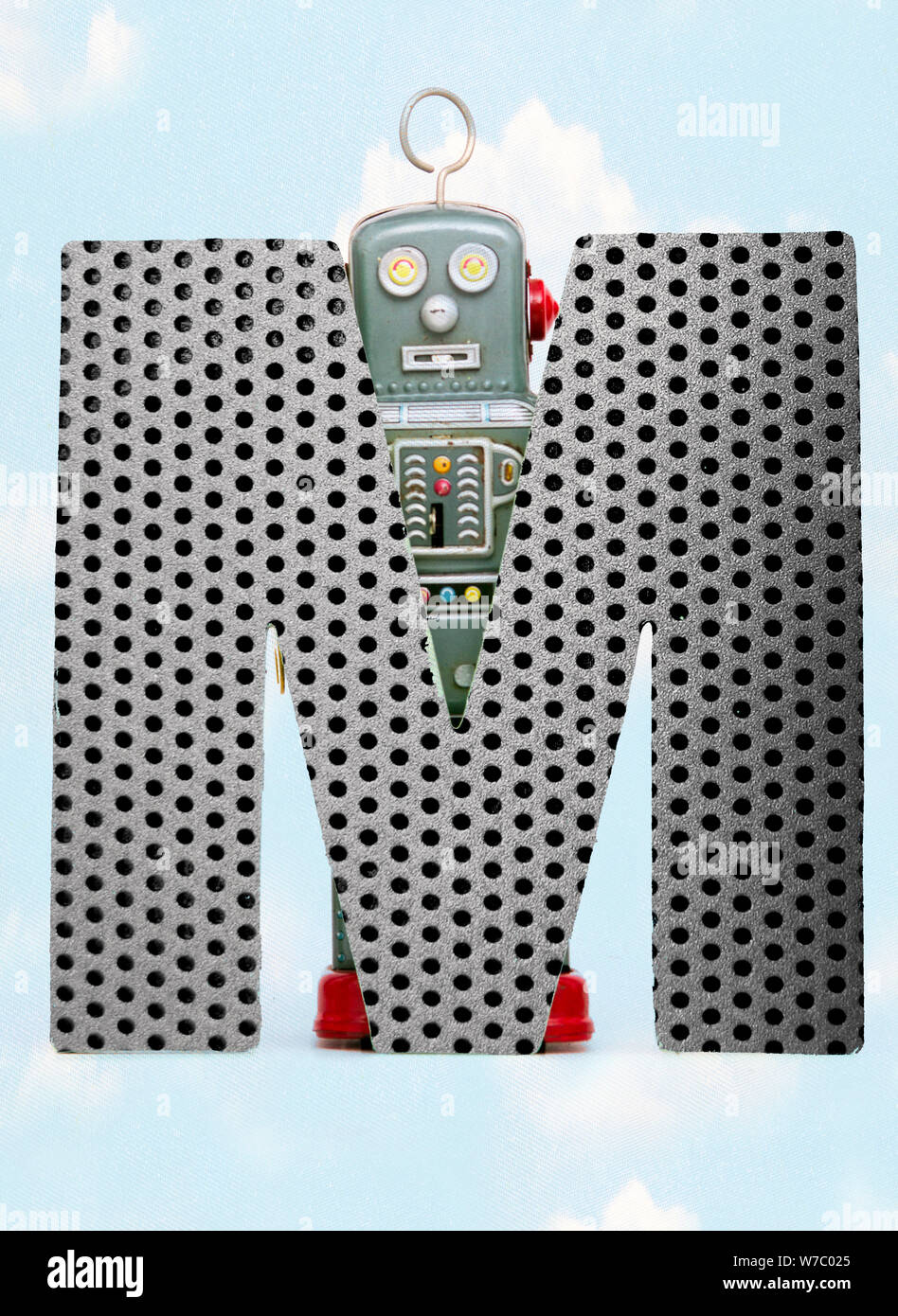 retro robots holding a big metal letter M with blue sky and clouds ...