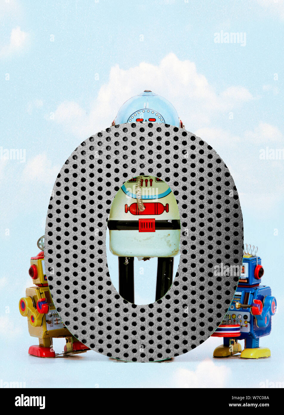 retro robots holding a big metal letter O with blue sky and clouds ...