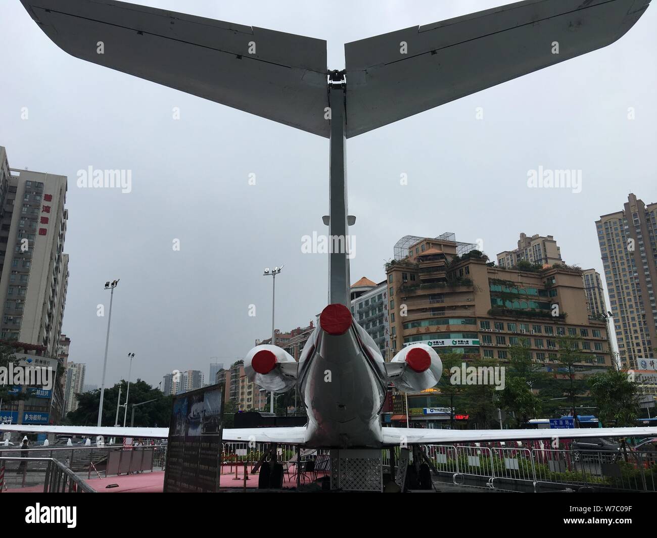 A private airplane is on display in front of a shopping mall in ...