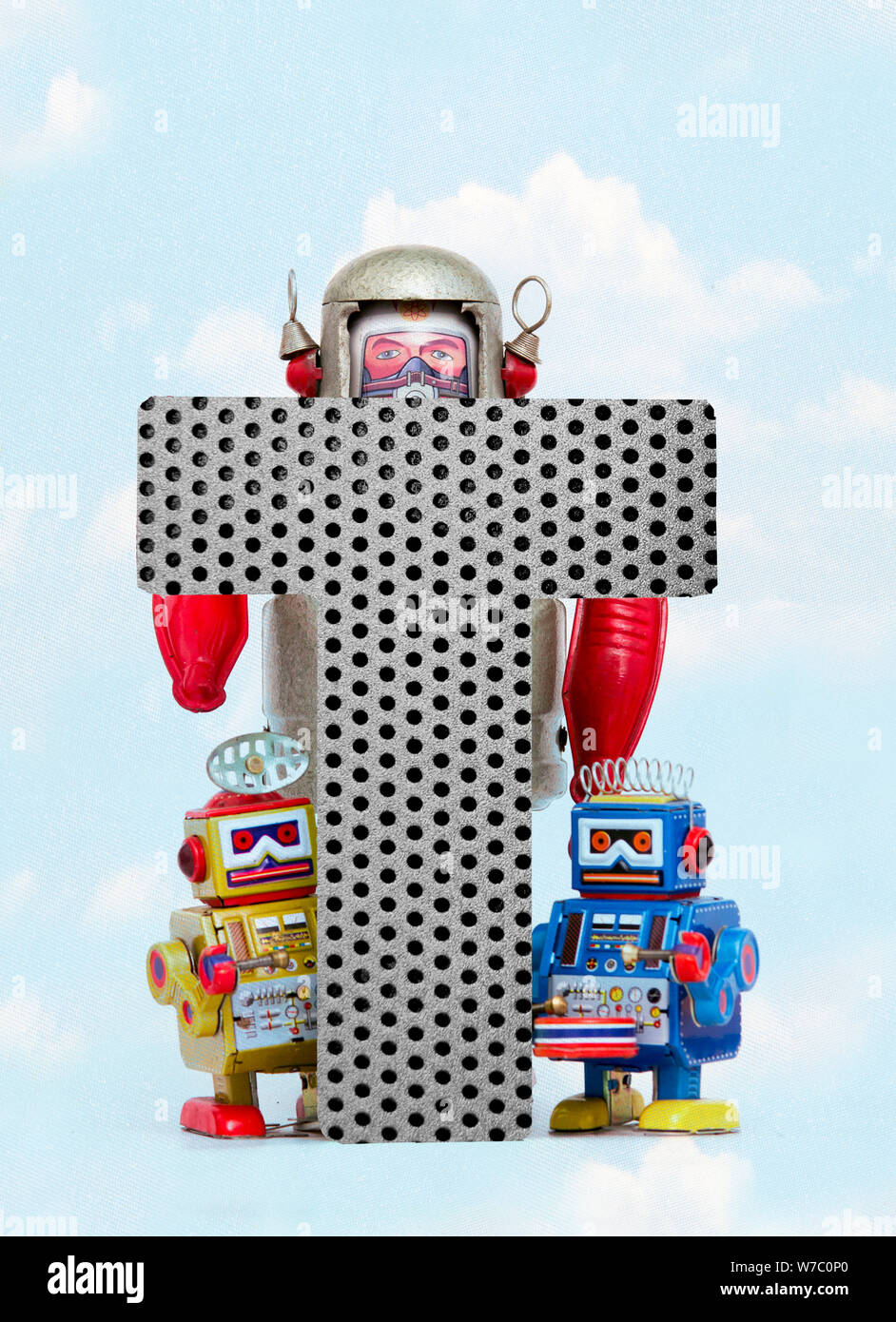 retro robots holding a big metal letter T with blue sky and clouds ...