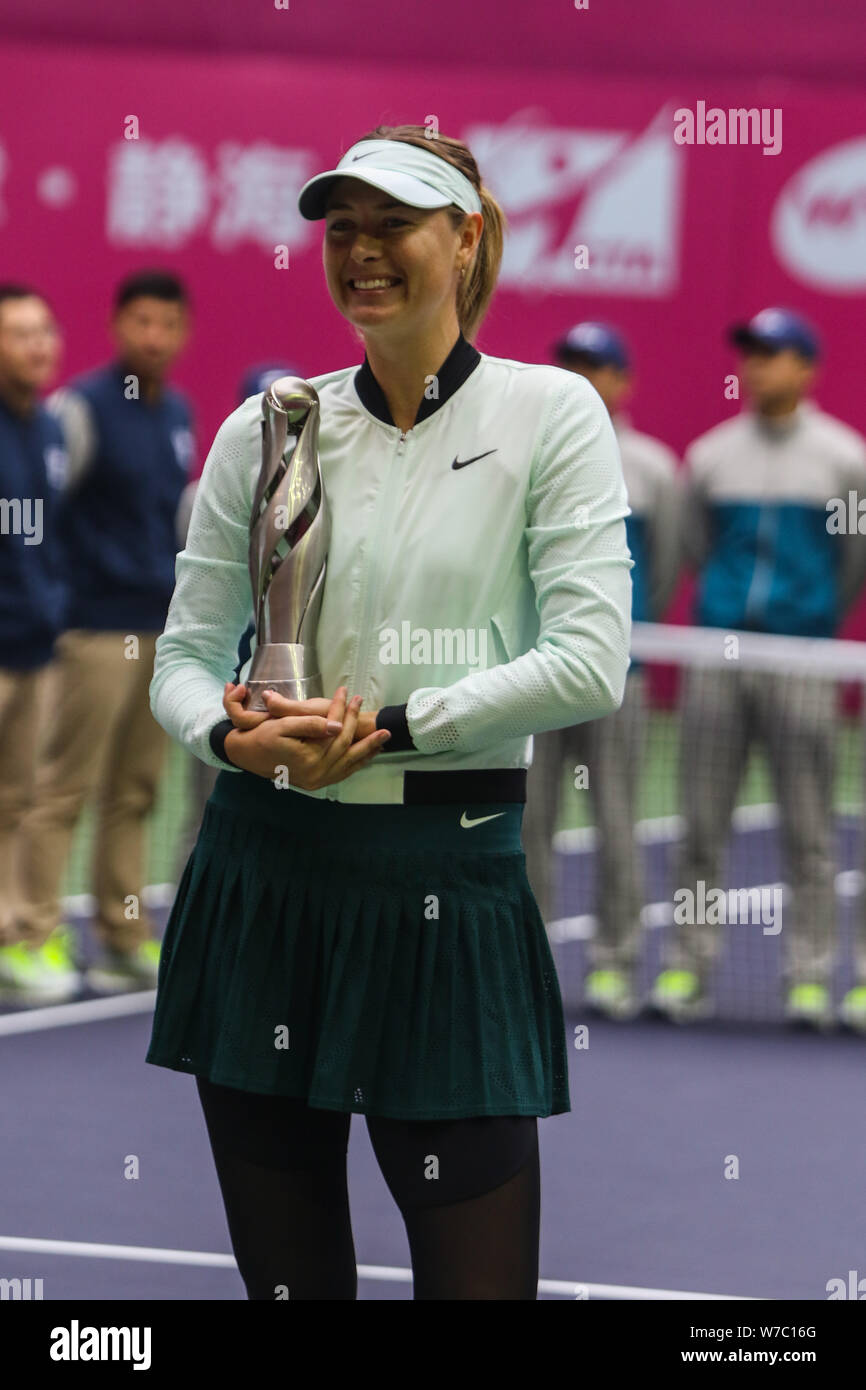 Maria Sharapova of Russia poses with her trophy at the award ceremony ...
