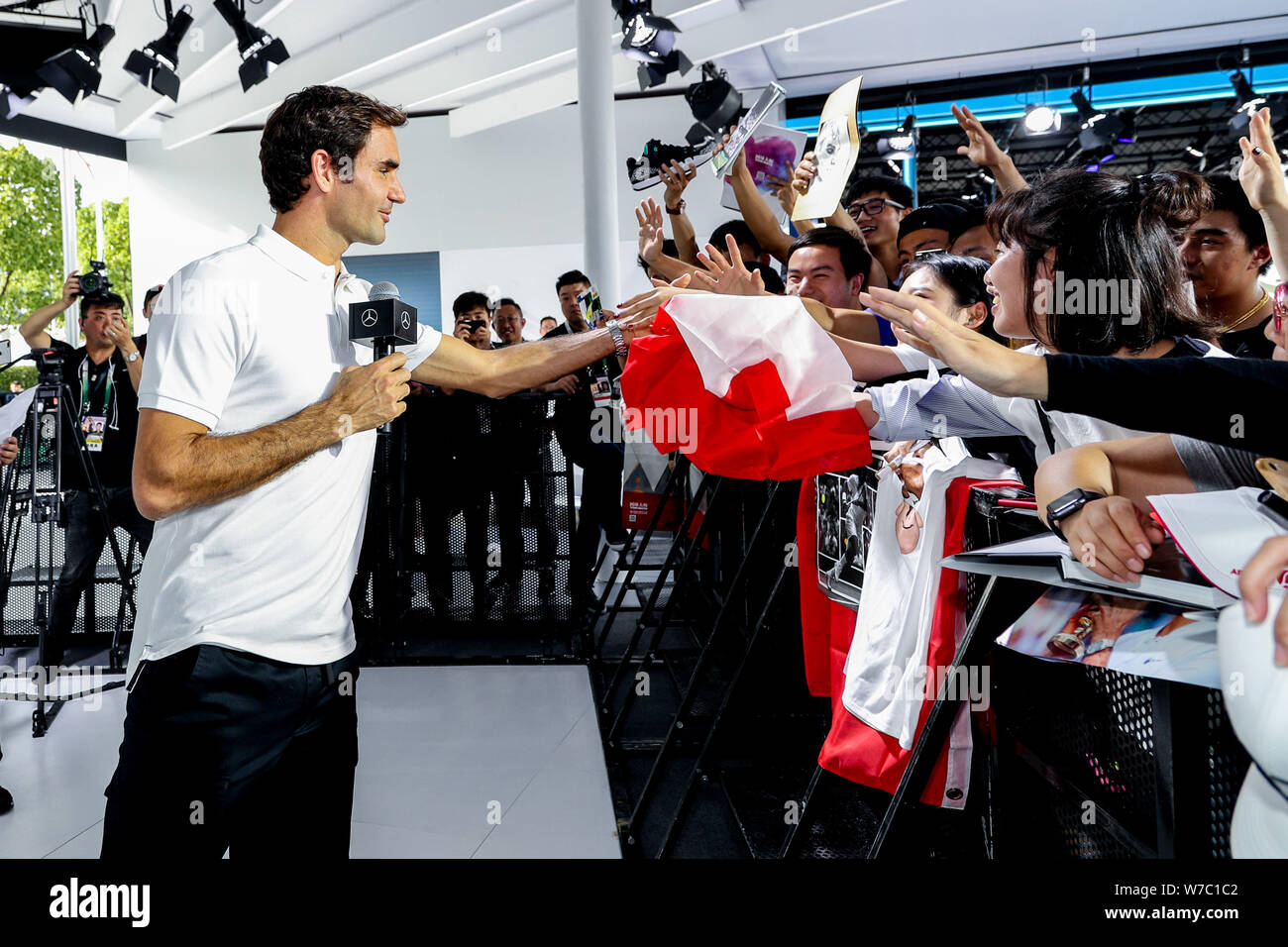 Swiss tennis player Roger Federer interacts with fans at a promotional ...