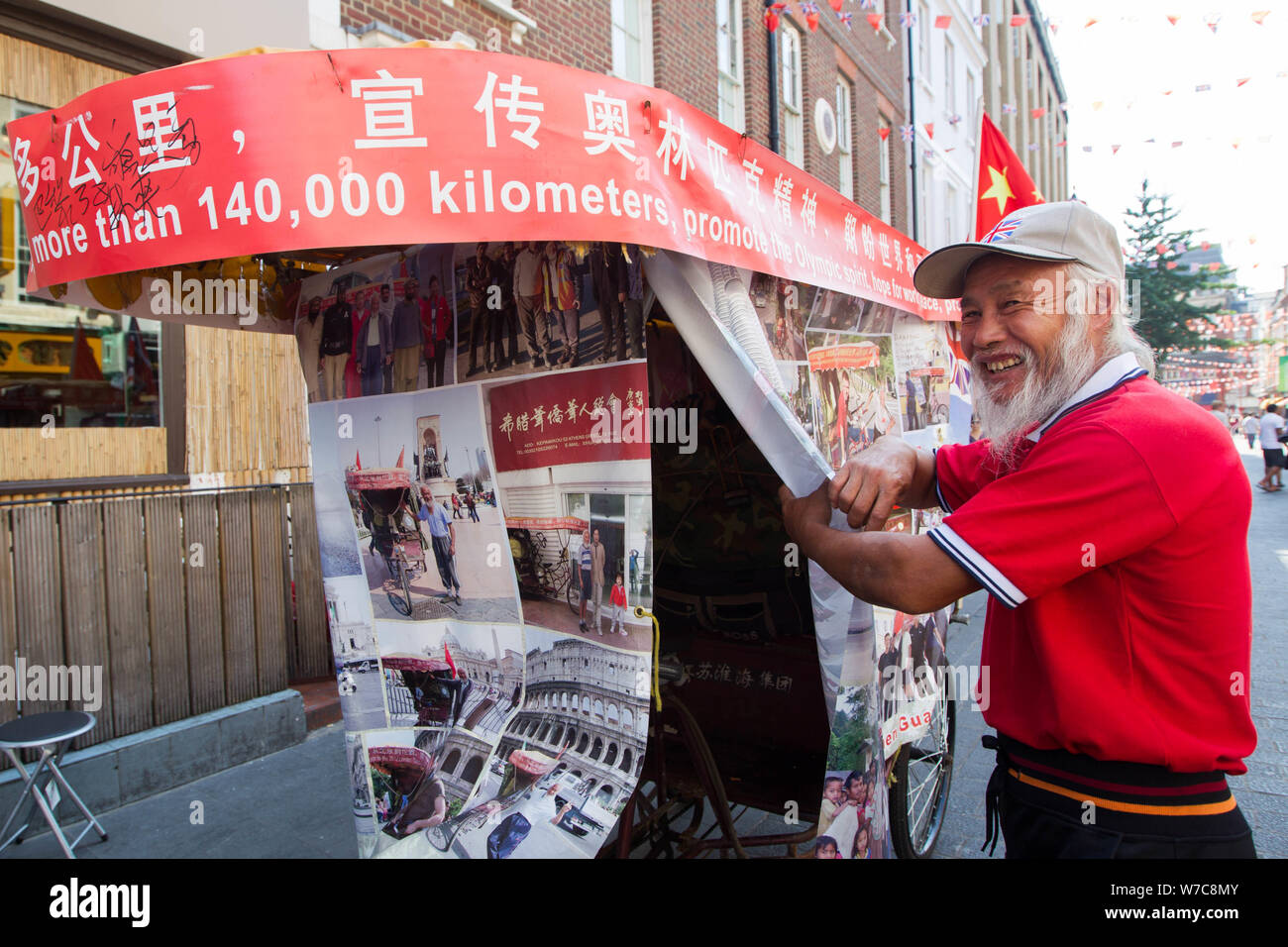 --FILE--Chinese farmer Chen Guanming smiles as he talks to tourists after he claimed to have ...