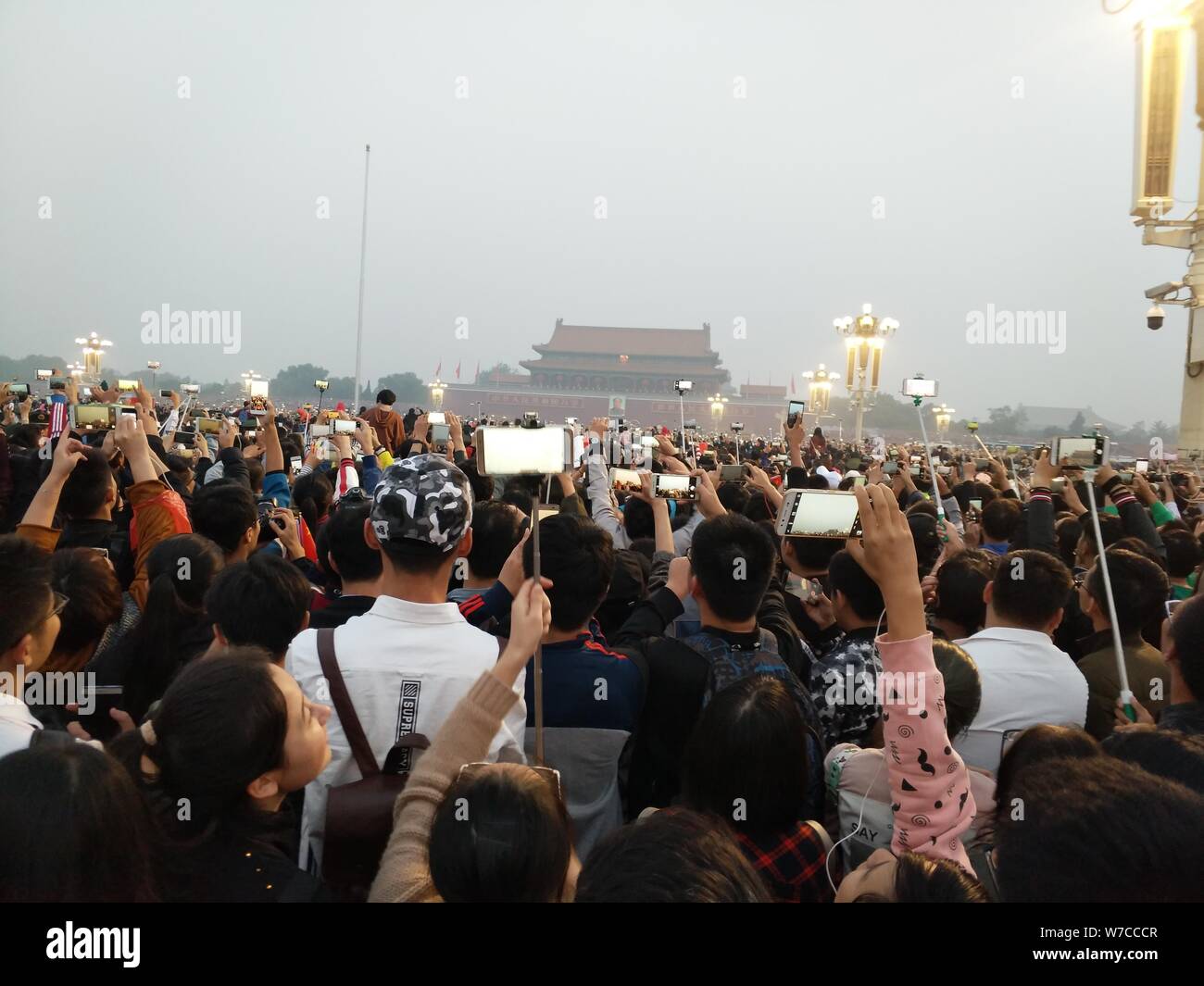 People take photos of the Chinese national flag during the national ...
