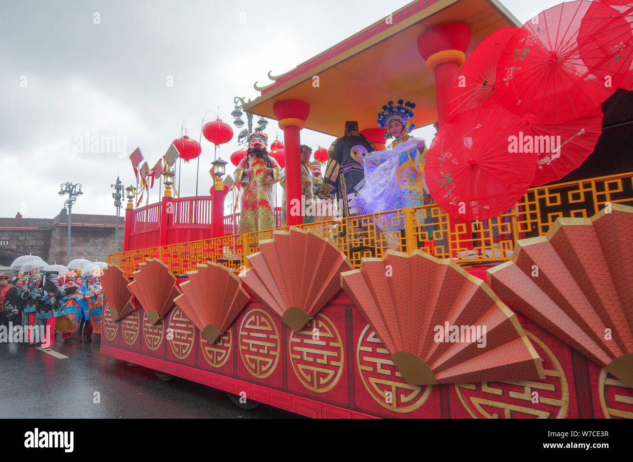 Chinese students perform in a China-themed float during their march to ...