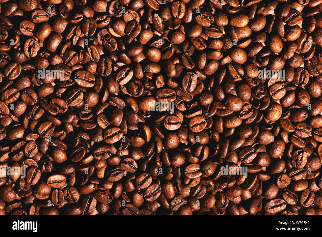 Close up of roasted coffee beans texture background Stock Photo - Alamy