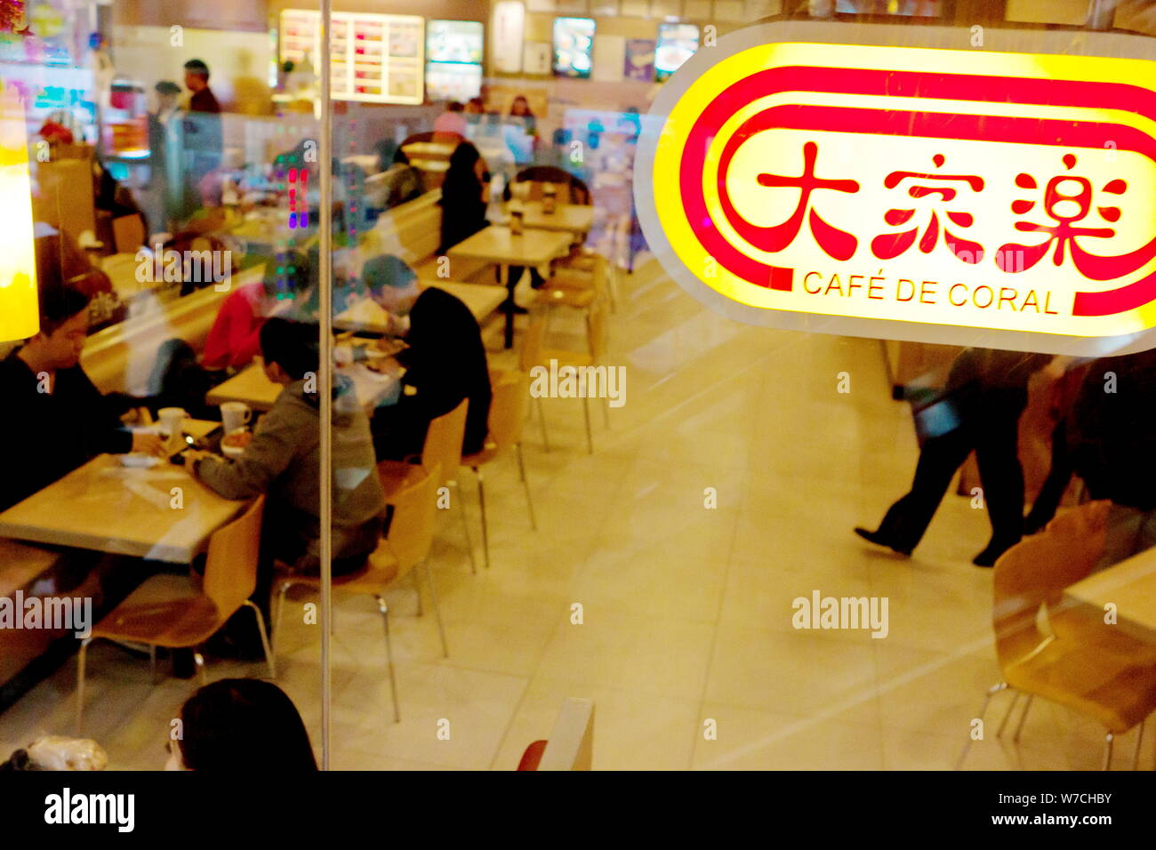--FILE--Customers eat at a store of Hong Kong fast food chain Cafe de Coral Holdings in ...