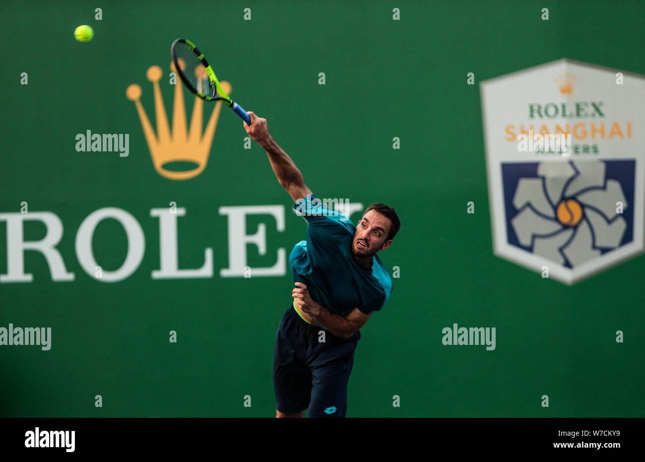 Viktor Troicki of Serbia serves against Denis Shapovalov of Canada in ...