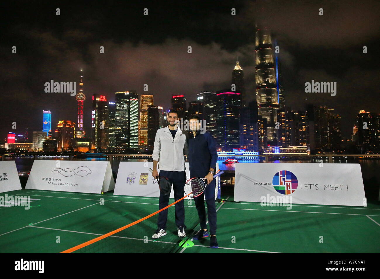 Croatian tennis player Marin Cilic, left, takes photos with Bulgarian ...