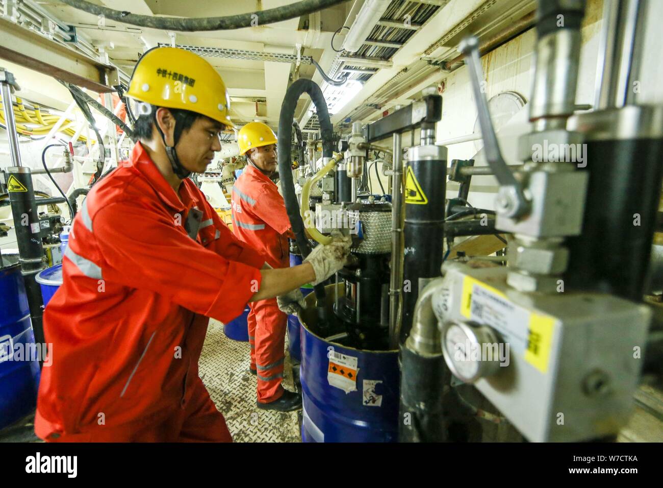 Chinese workers labor at the construction site of the world's first ...