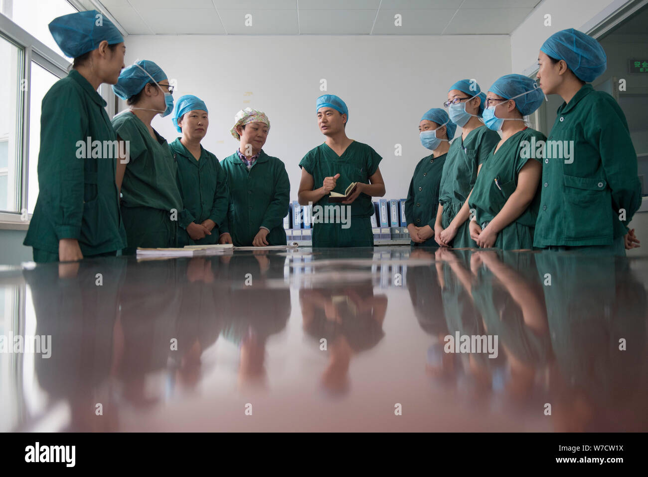 Qiao Rui, center, the sole male chief nurse at the Affiliated Hospital ...
