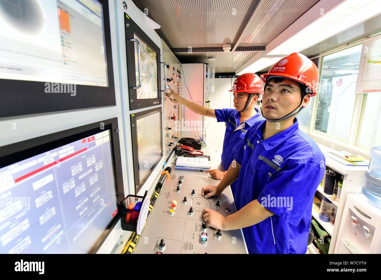 Chinese workers labor at the construction site of the world's first ...