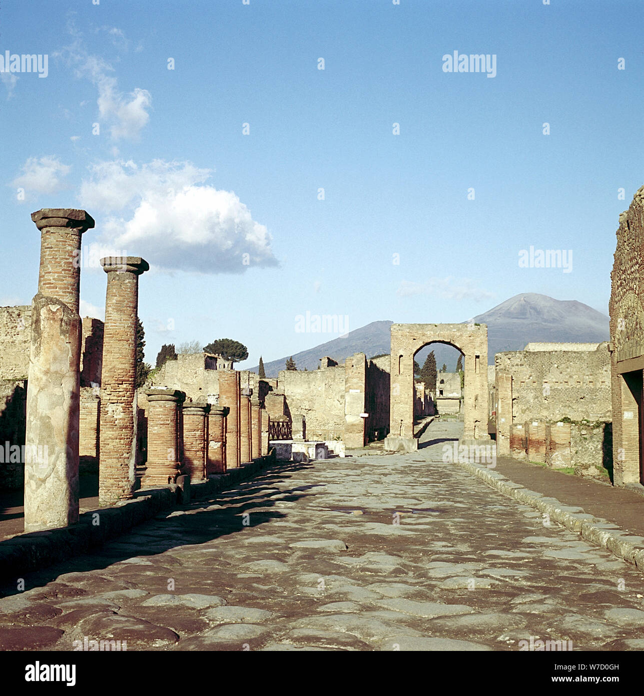Road leading to Arch of Caligula with Vesuvius beyond, Pompeii, Italy ...