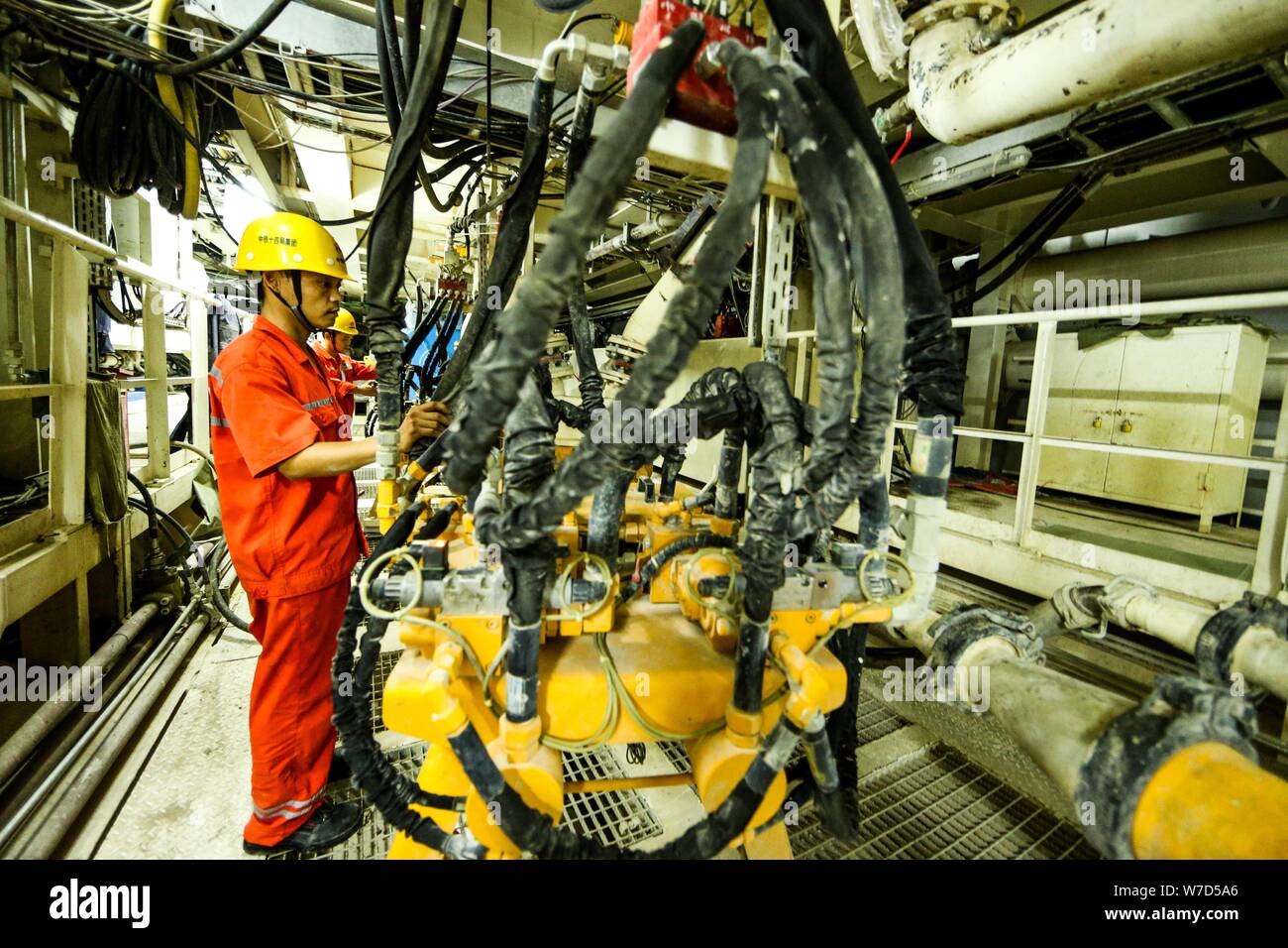Chinese workers labor at the construction site of the world's first ...