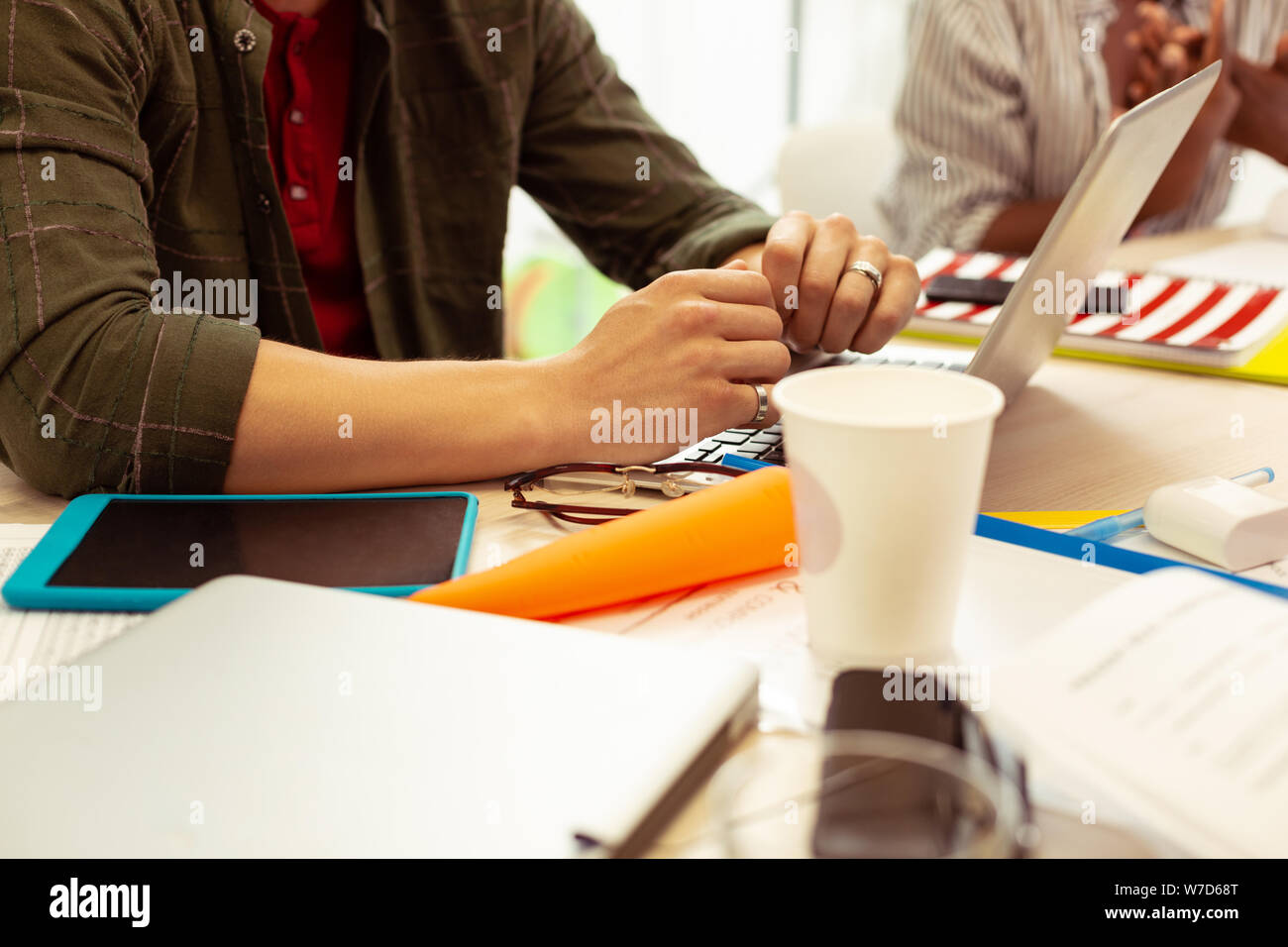 Modern young male person using gadgets during lesson Stock Photo - Alamy