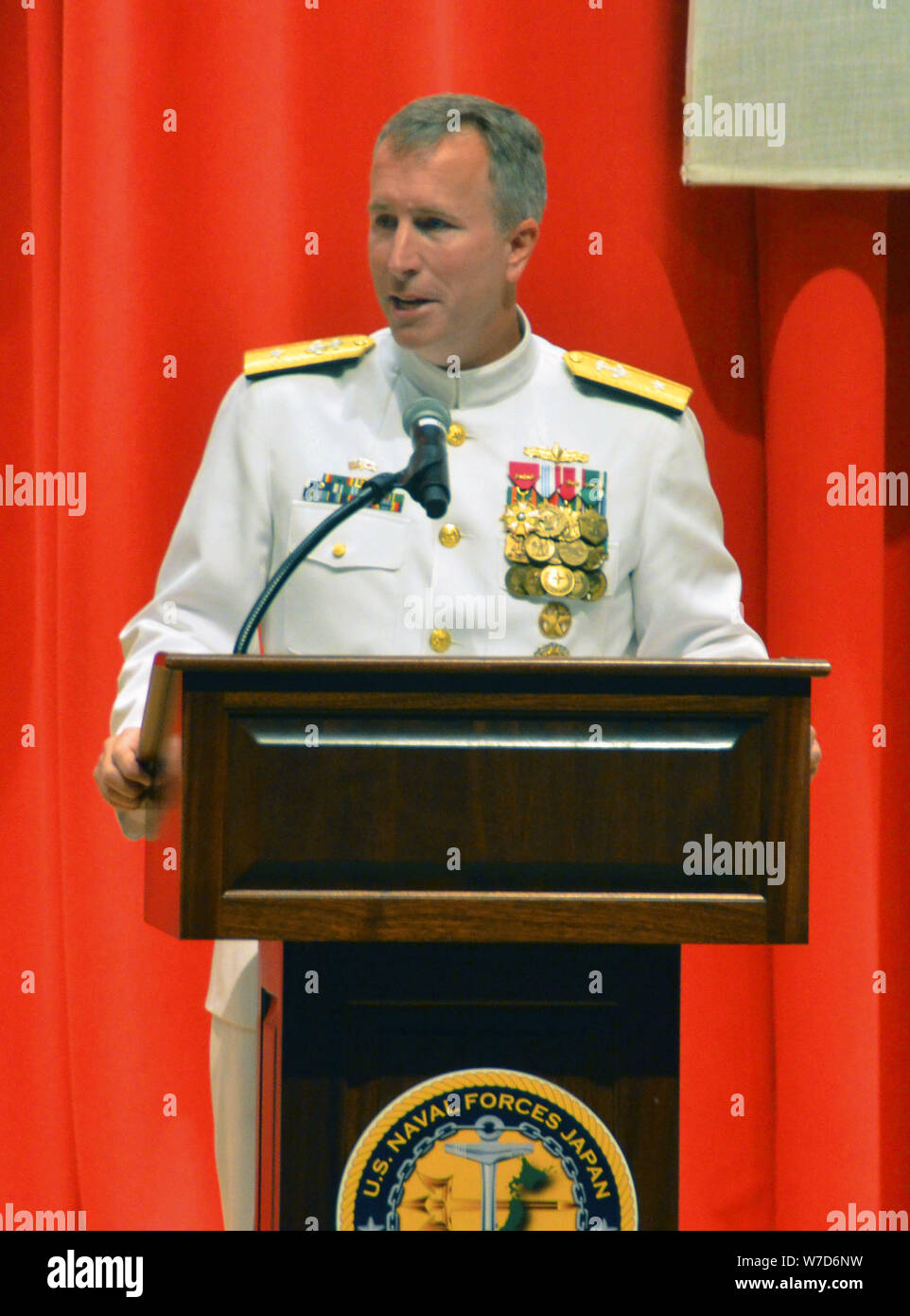 Rear Adm. Brian Fort delivers a speech at a ceremony at the Yokosuka ...