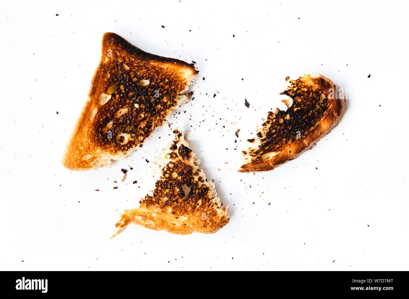 slice of toasted bread burned and teared apart, isolated Stock Photo ...