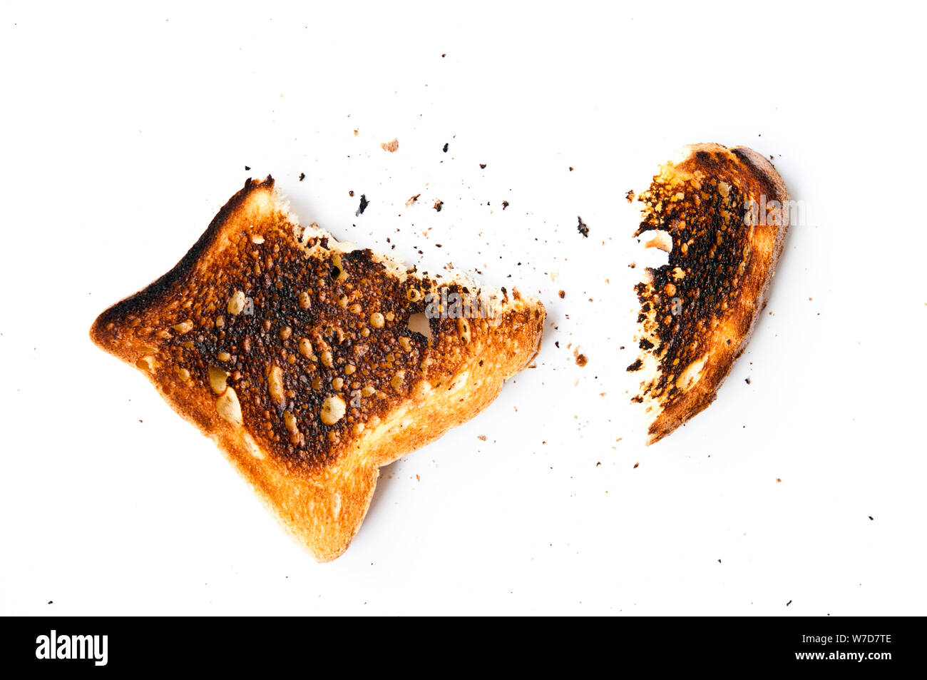 slice of toasted bread burned and teared apart, isolated Stock Photo ...