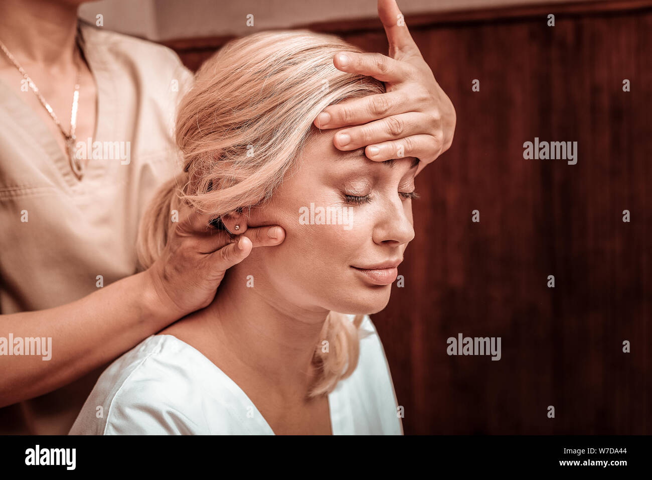 Relaxed woman getting her head massage in salon Stock Photo - Alamy