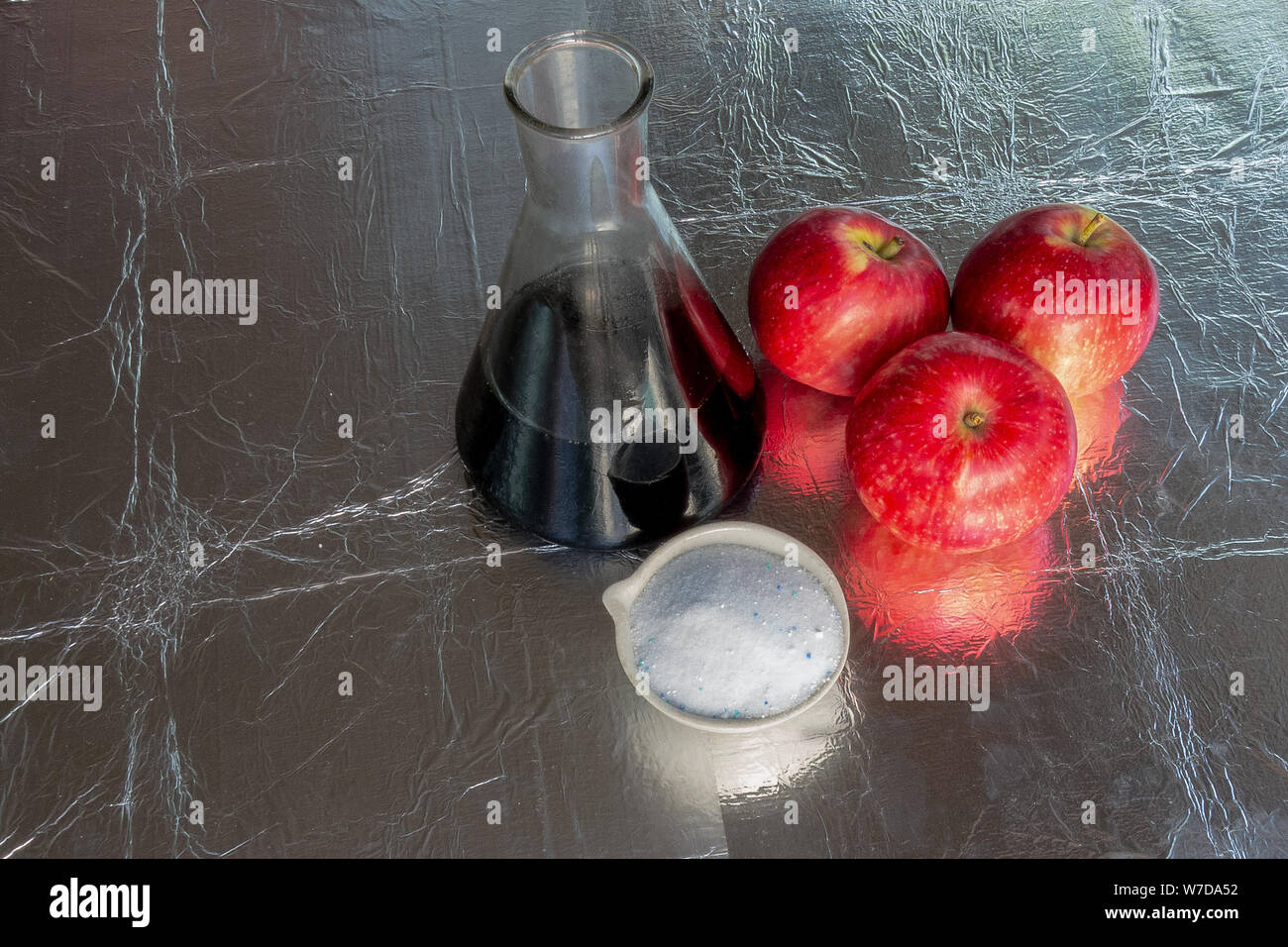 Agriculture chemical in fruits. Close up of apples next to fertilizers ...