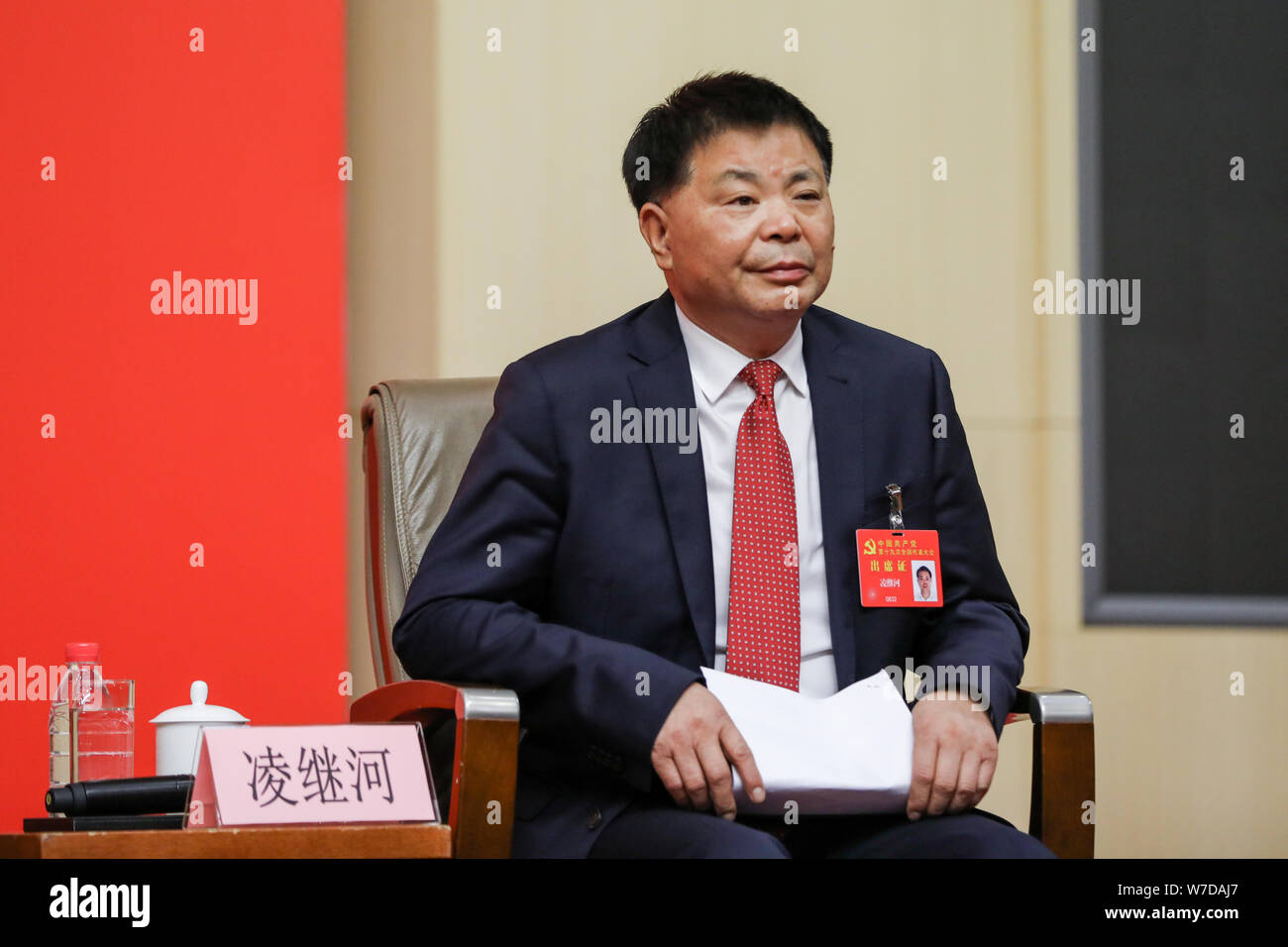 Ling Jihe, a farmer from Anyi county of Jiangxi province, attends a ...
