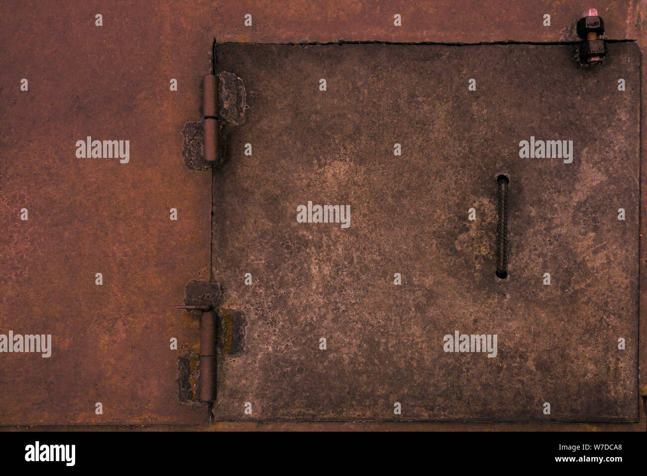 Metal rustic door hatch. Weathered vintage industrial surface with ...