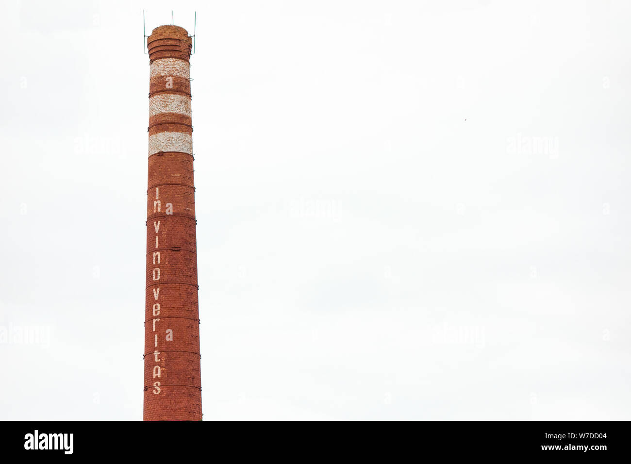 Smokestack in shape of wine bottle neck with text In vino veritas ...