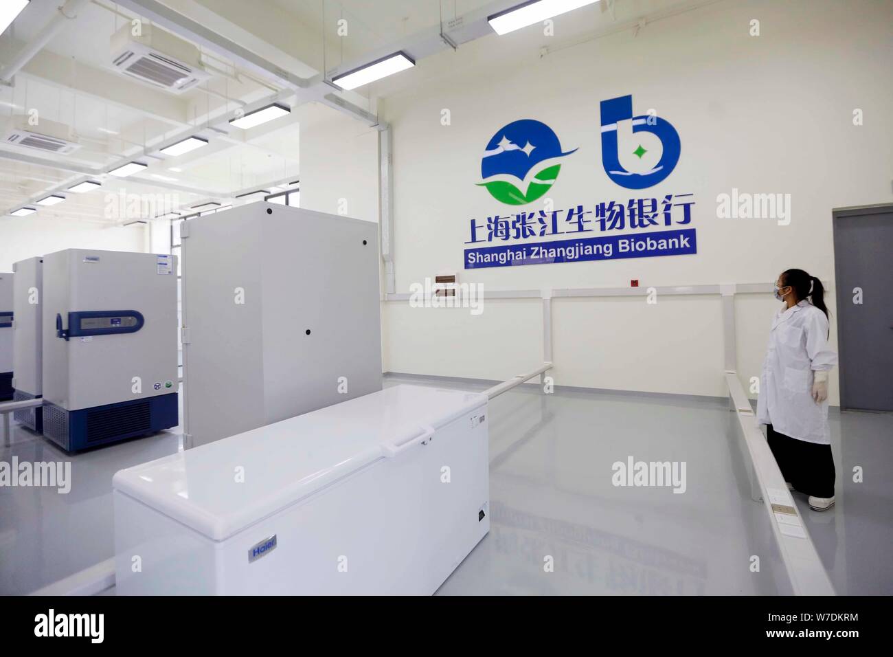 A Chinese researcher is seen at the China's largest biobank, Shanghai ...