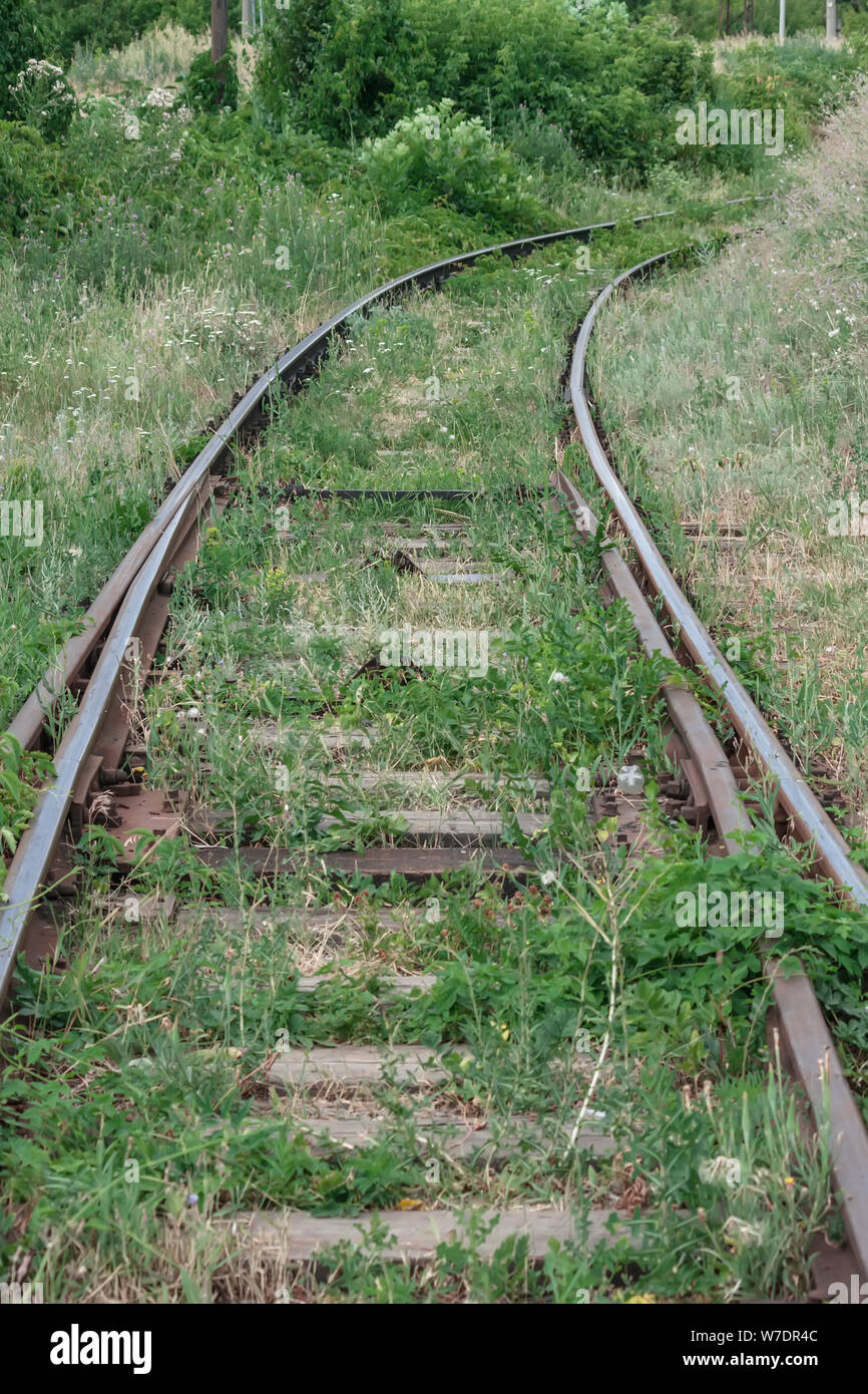 Old rails in landscape. Rails in the land. Rails and cross ties.Railway ...