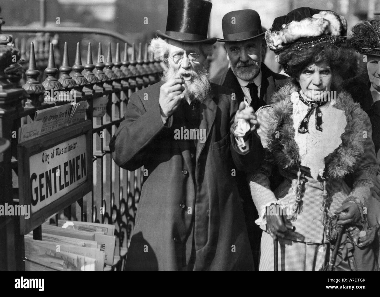 A group of people passing a gents' public toilet, Westminster, London ...