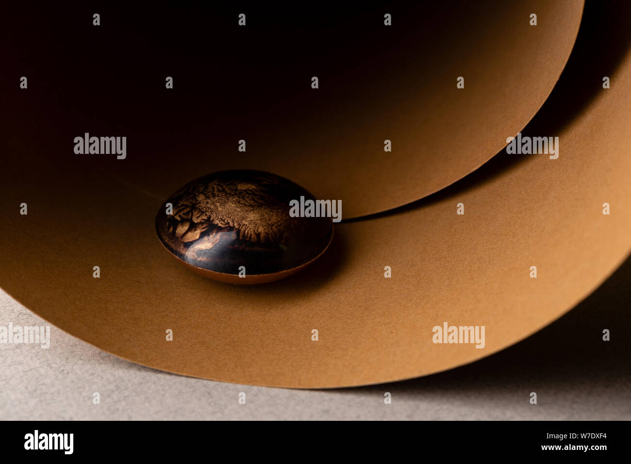 Brown modern art bonbon and paper backdrop Stock Photo - Alamy