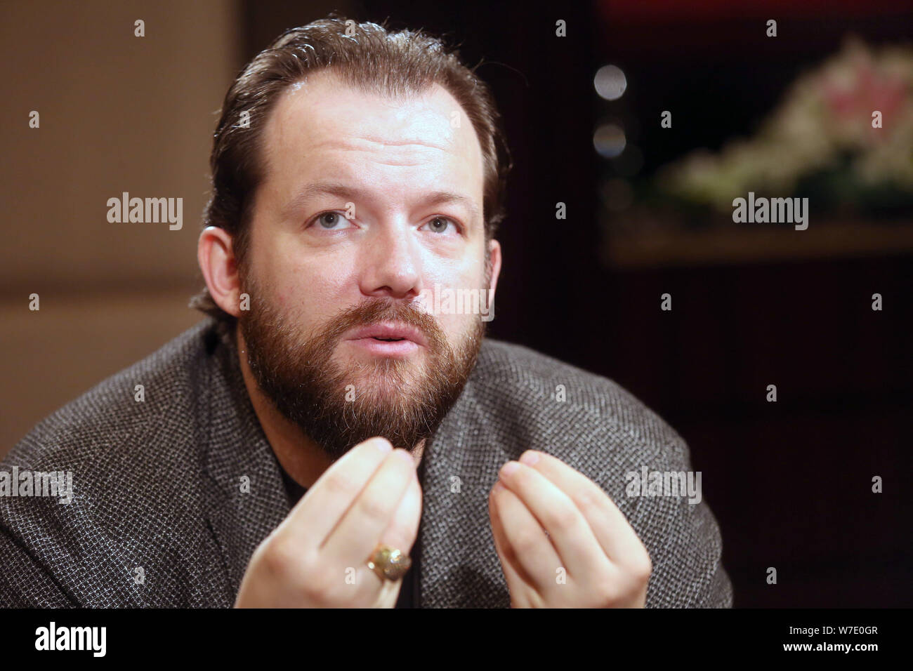 Latvian conductor Andris Nelsons, right, talks with Chinese TV host Cao ...
