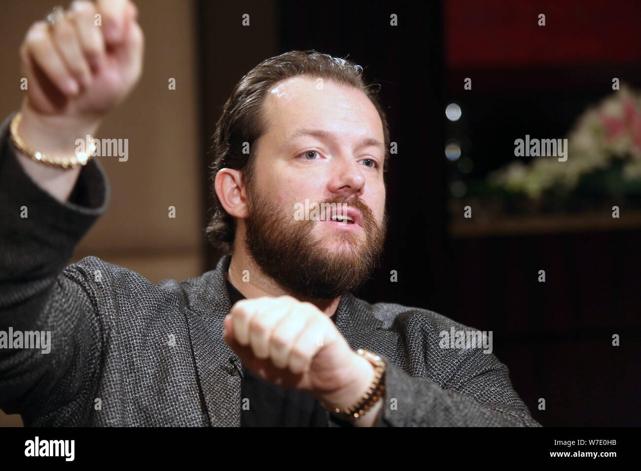 Latvian conductor Andris Nelsons, right, talks with Chinese TV host Cao ...