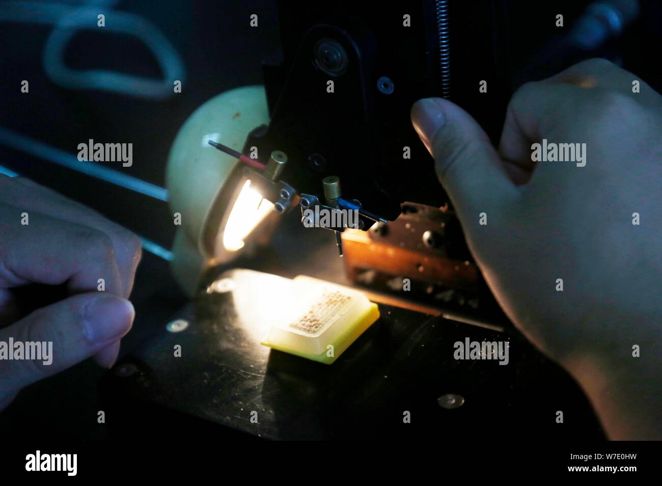 A Chinese researcher does experiments in a lab at the China's largest ...