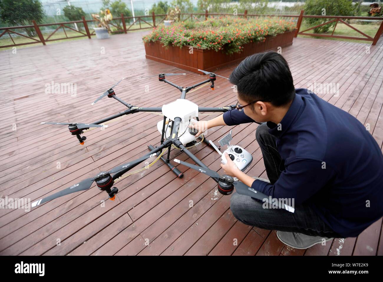 A Chinese enthusiast checks a drone, or UAV (unmanned aerial vehicle ...