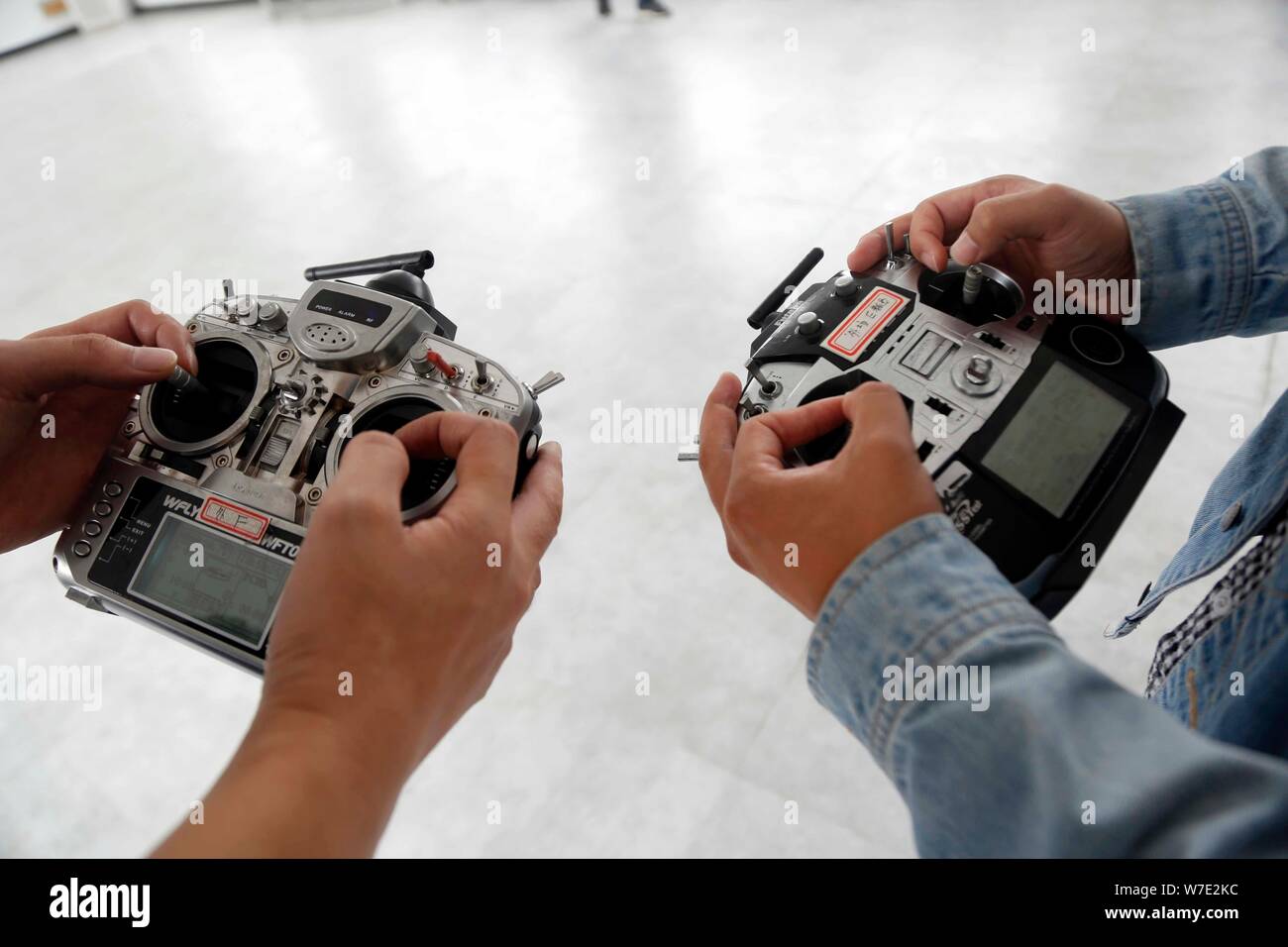 Chinese enthusiasts test remote controls for drone, or UAV (unmanned ...
