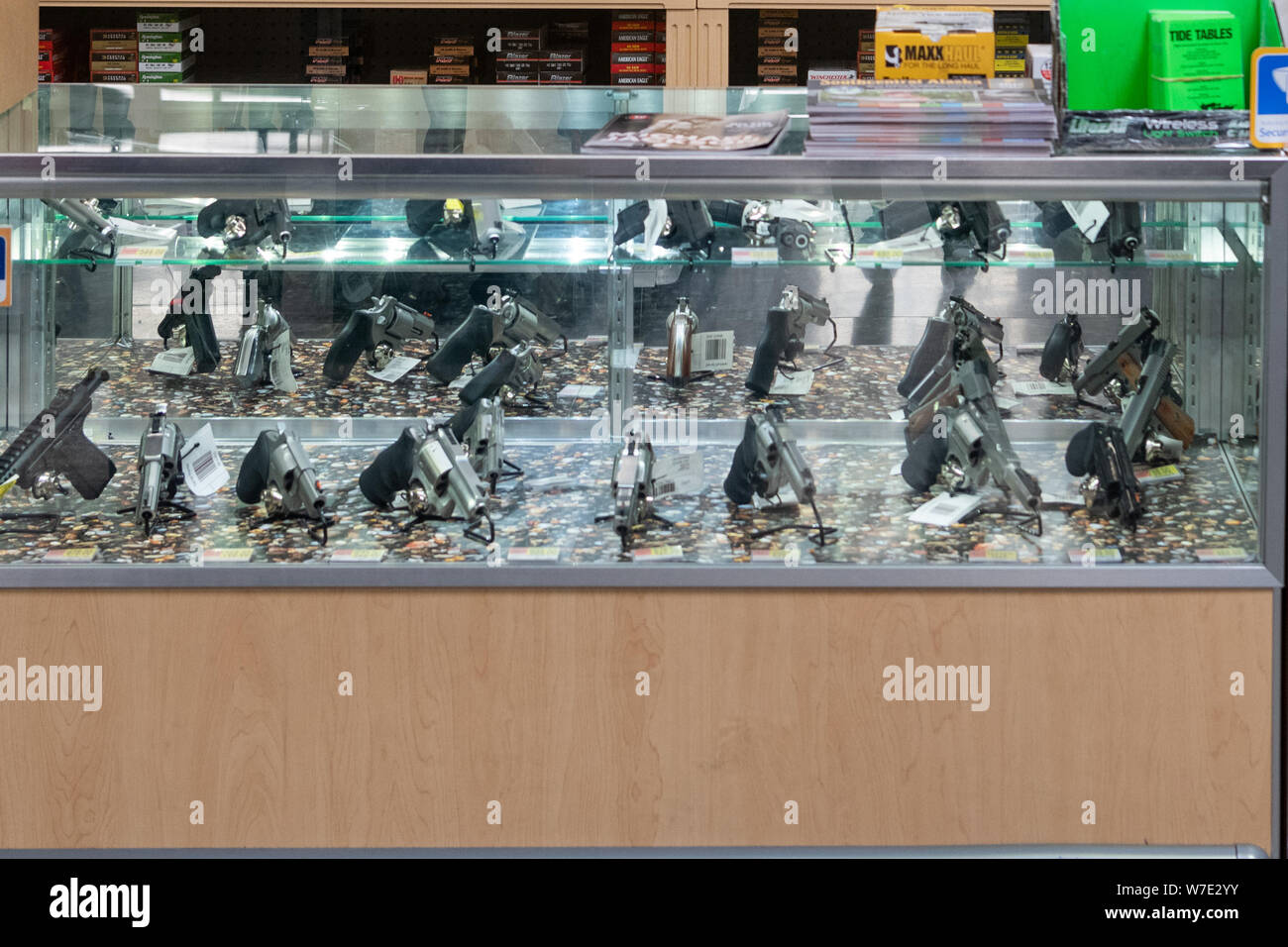 Hand guns in a display case for sale at Walmart Stock Photo - Alamy