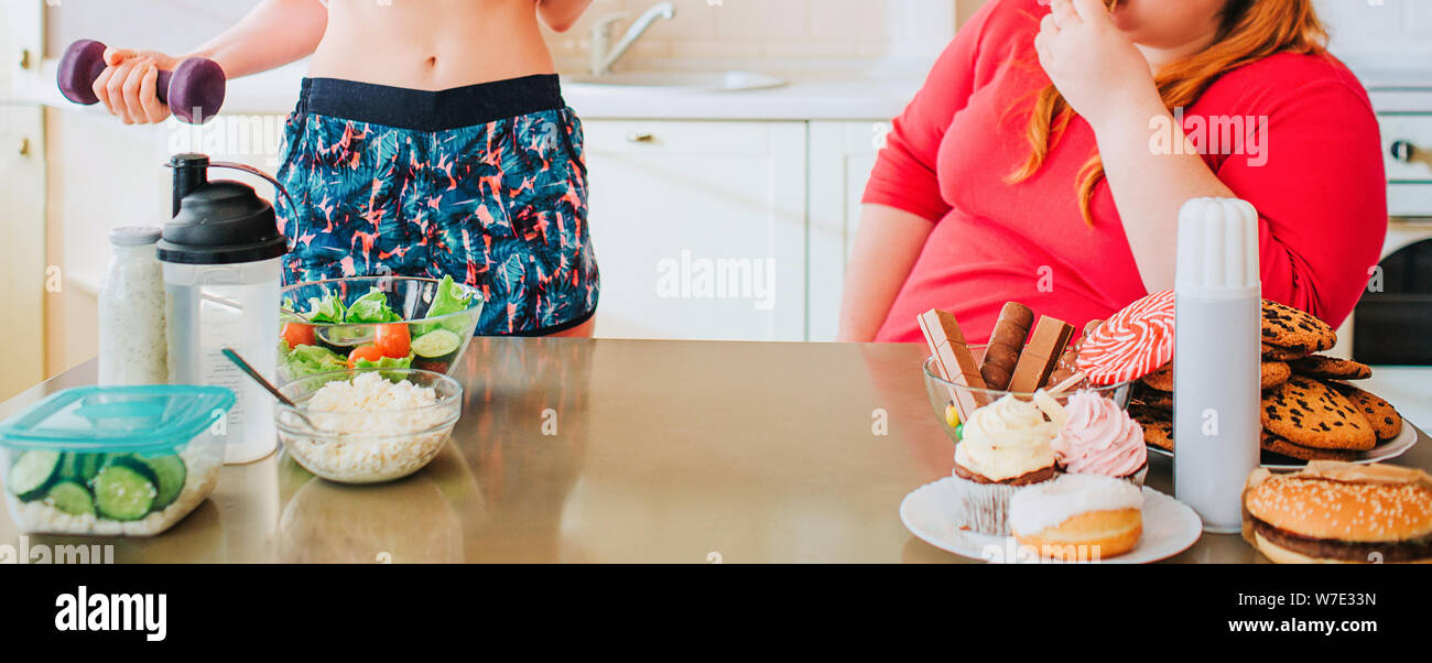 Cut view of young slim model and overweight woman in kitchen. Well ...